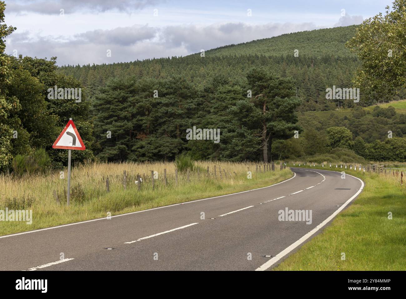 Road with bend sign, Cairngorms National Park, Grantown-on-Spey ...