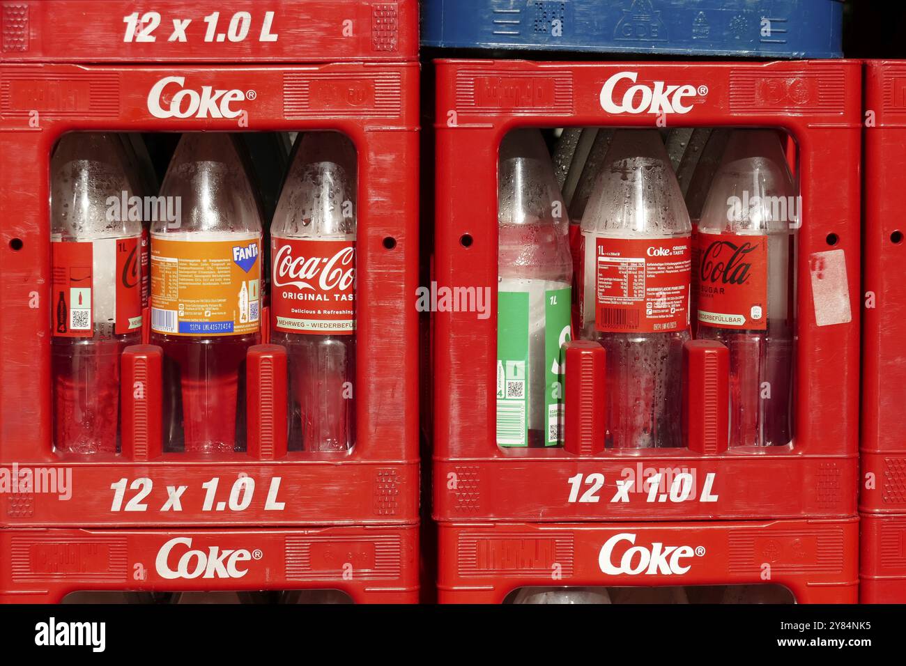 Empty plastic deposit bottles of the Coca Cola brand in a drinks crate ...