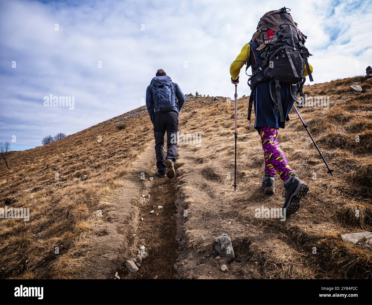 Trekking scene on Lake Como alps Stock Photo - Alamy