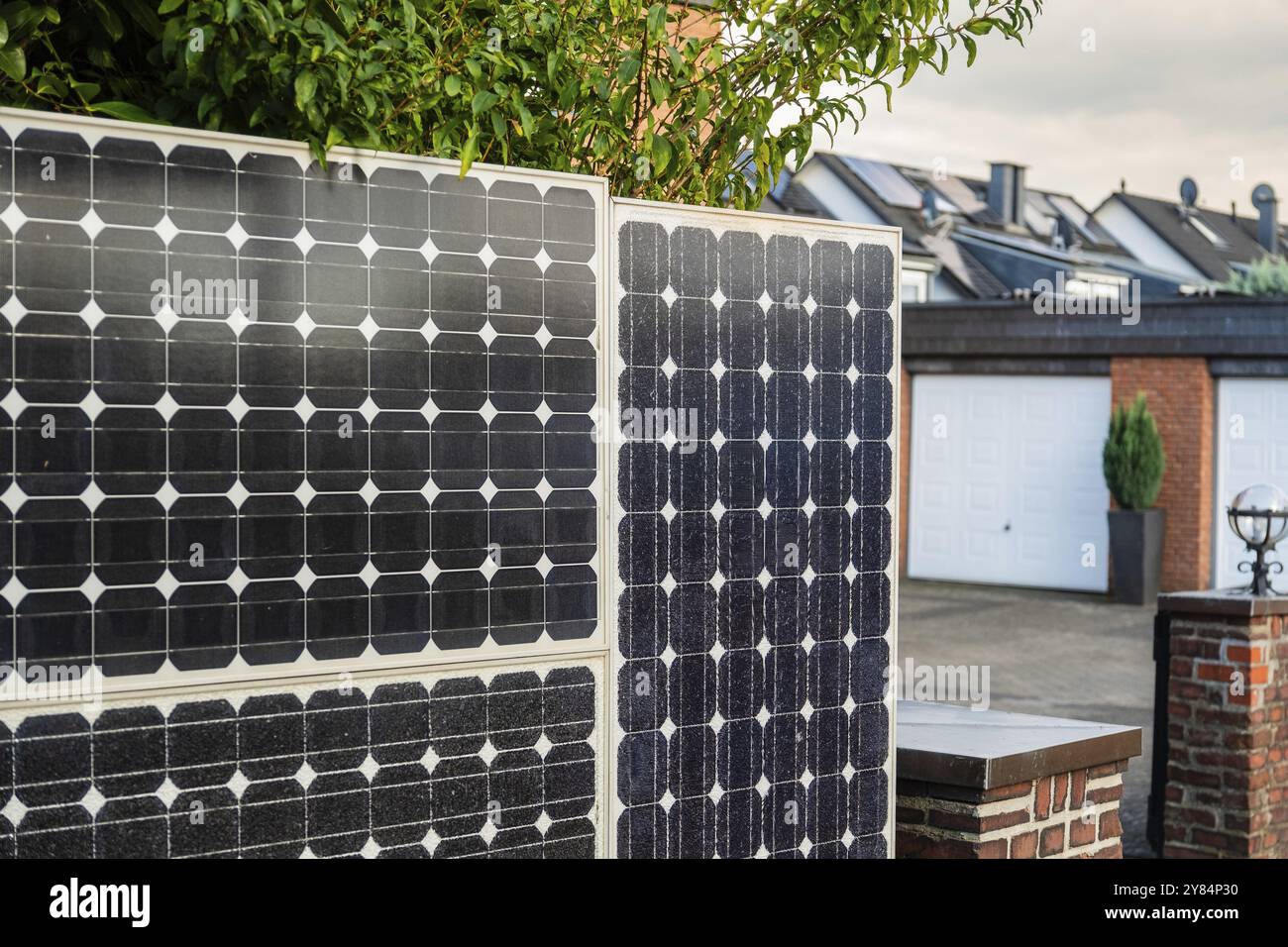 Solar fence, solar panels as a garden fence and privacy screen on a ...