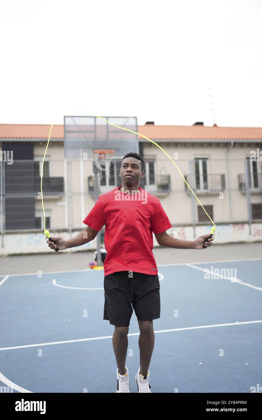 Vertical photo with copy space of a young sportive african young man ...