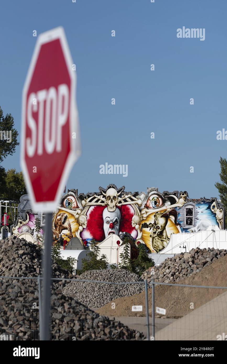 Face of a horror clown, over clown skull, ghost train, fair, fairground ...
