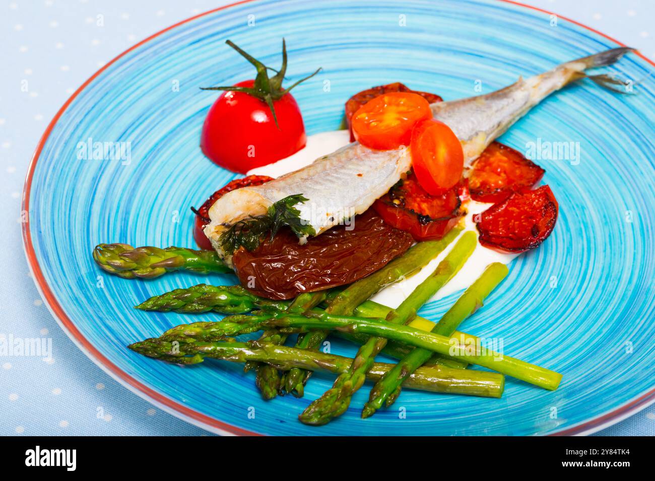 Oven baked blue whiting fish hi-res stock photography and images - Alamy