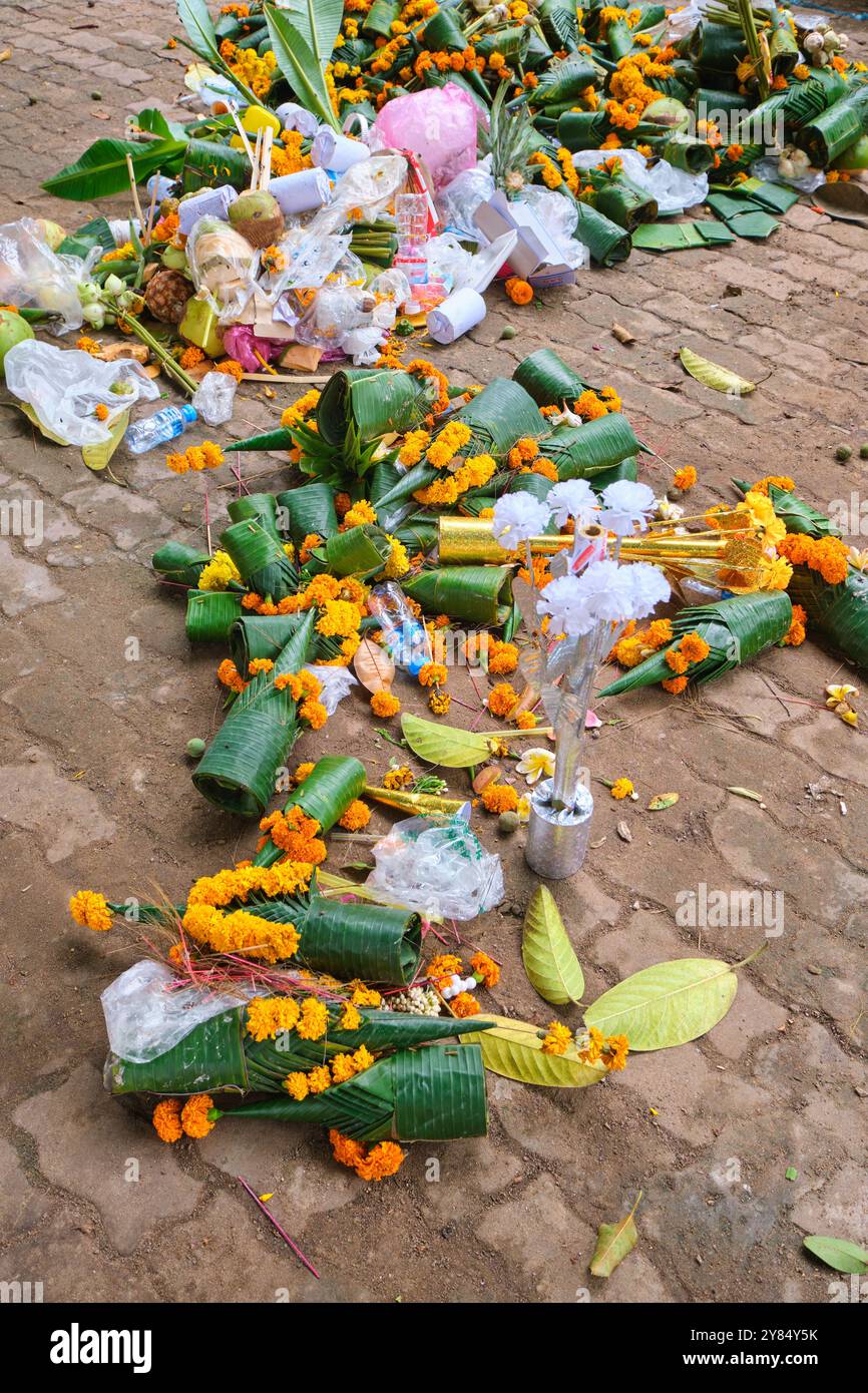 Old flower offerings, now a pile of trash, garbage. At Wat Si Muang ...