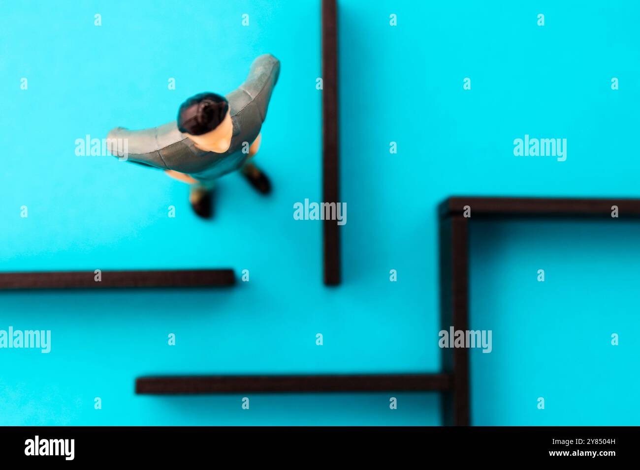 Executive looking for an exit in a maze Stock Photo - Alamy