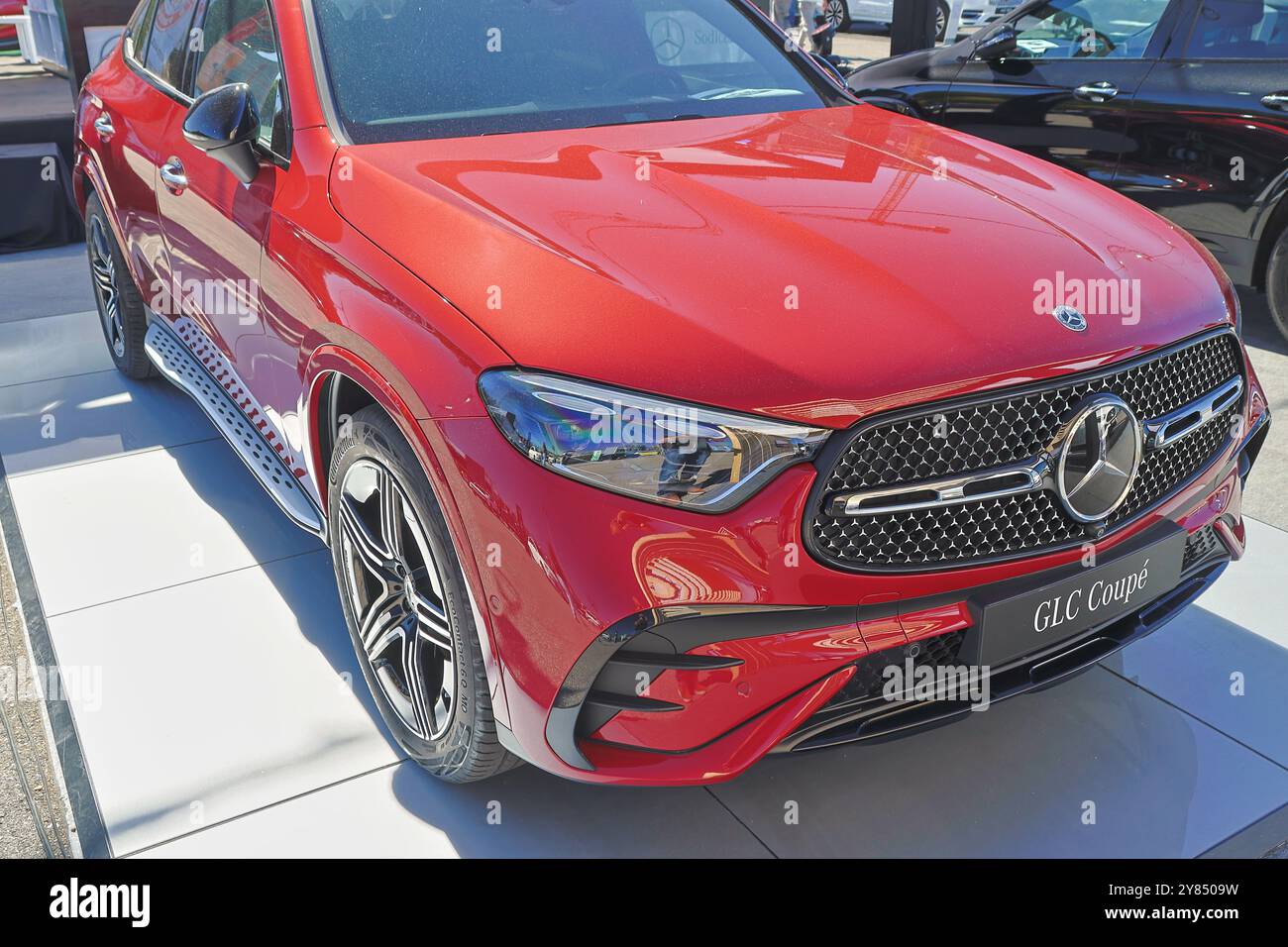 Modern red mercedes glc coupe parked on display at a car dealership ...