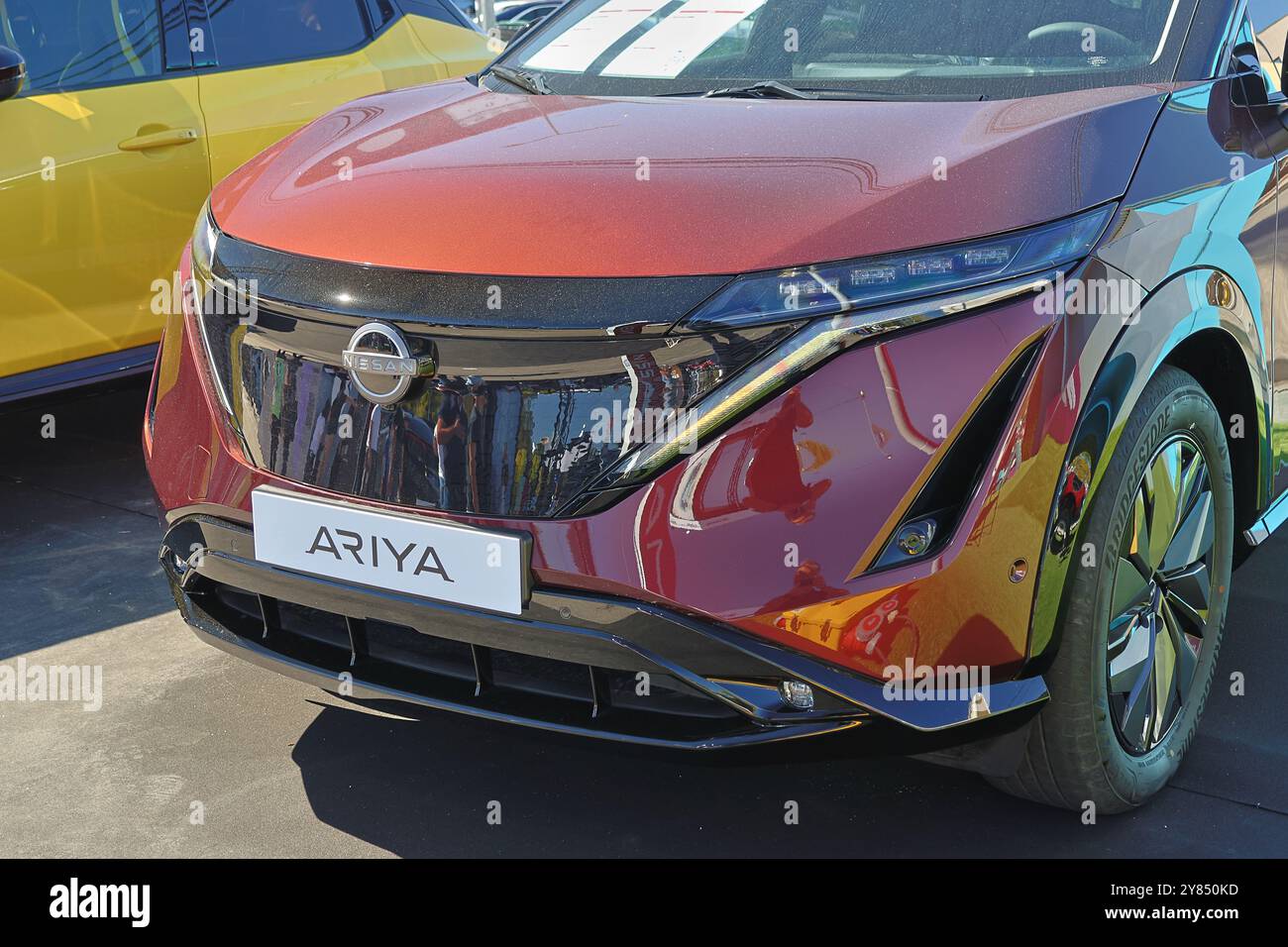 The new nissan ariya, a fully electric suv crossover, parked at a ...