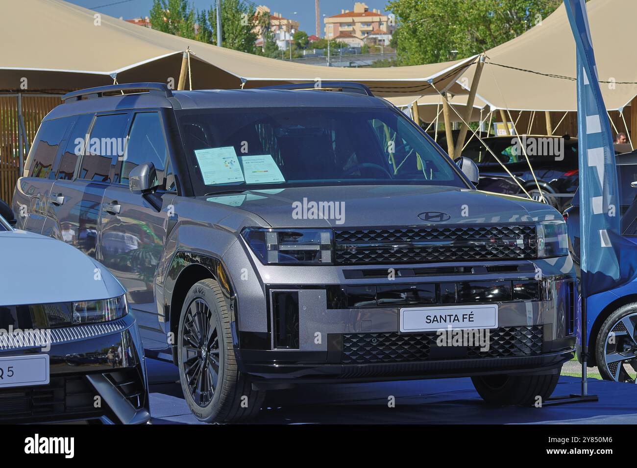 Brand new hyundai santa fe is standing on a podium at a car show during ...