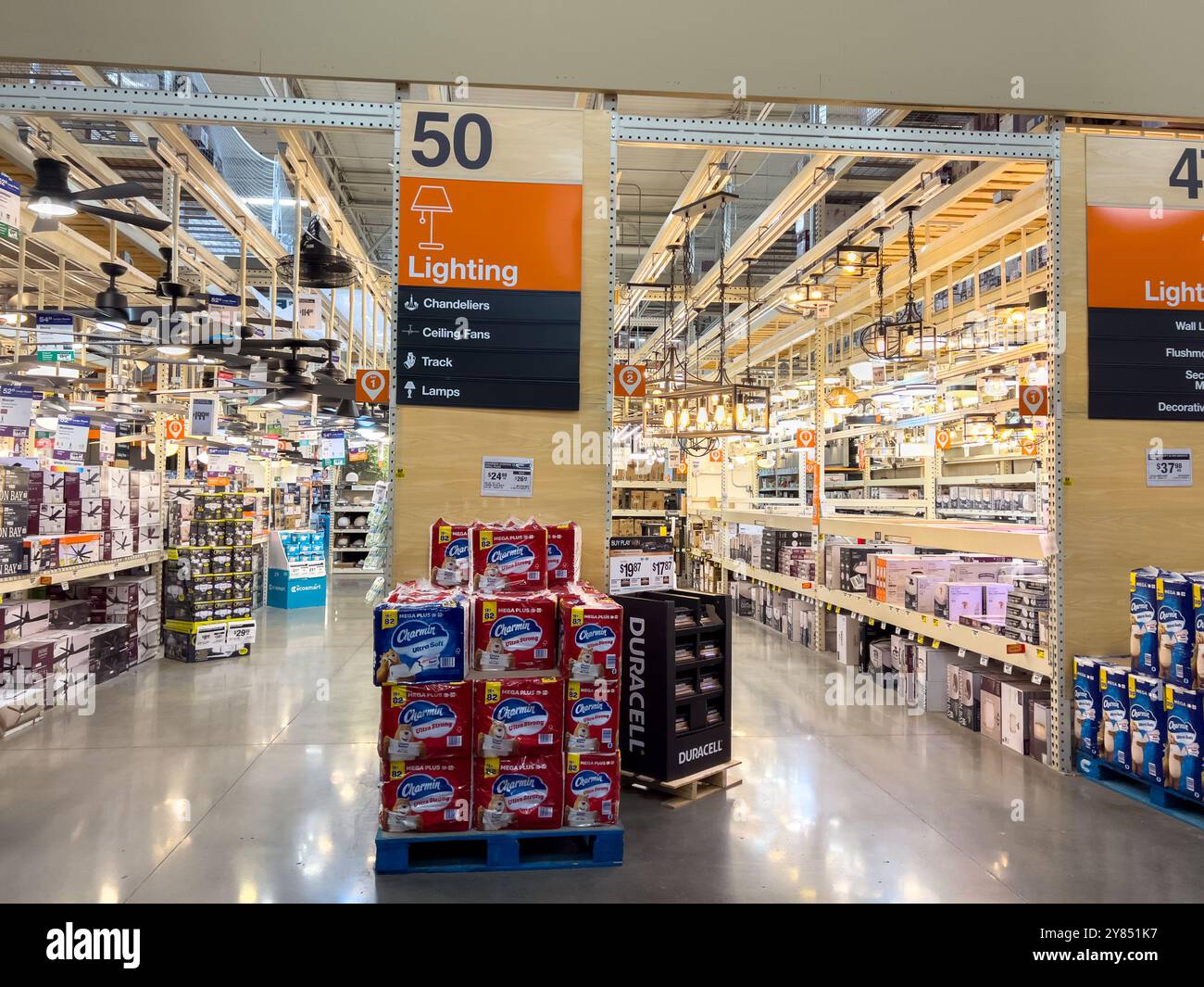 Lighting Section in a Hardware Store with Ceiling Fans and Lamps on ...