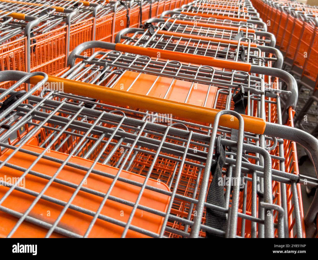 Rows of Orange Shopping Carts Outside Store Entrance Stock Photo - Alamy