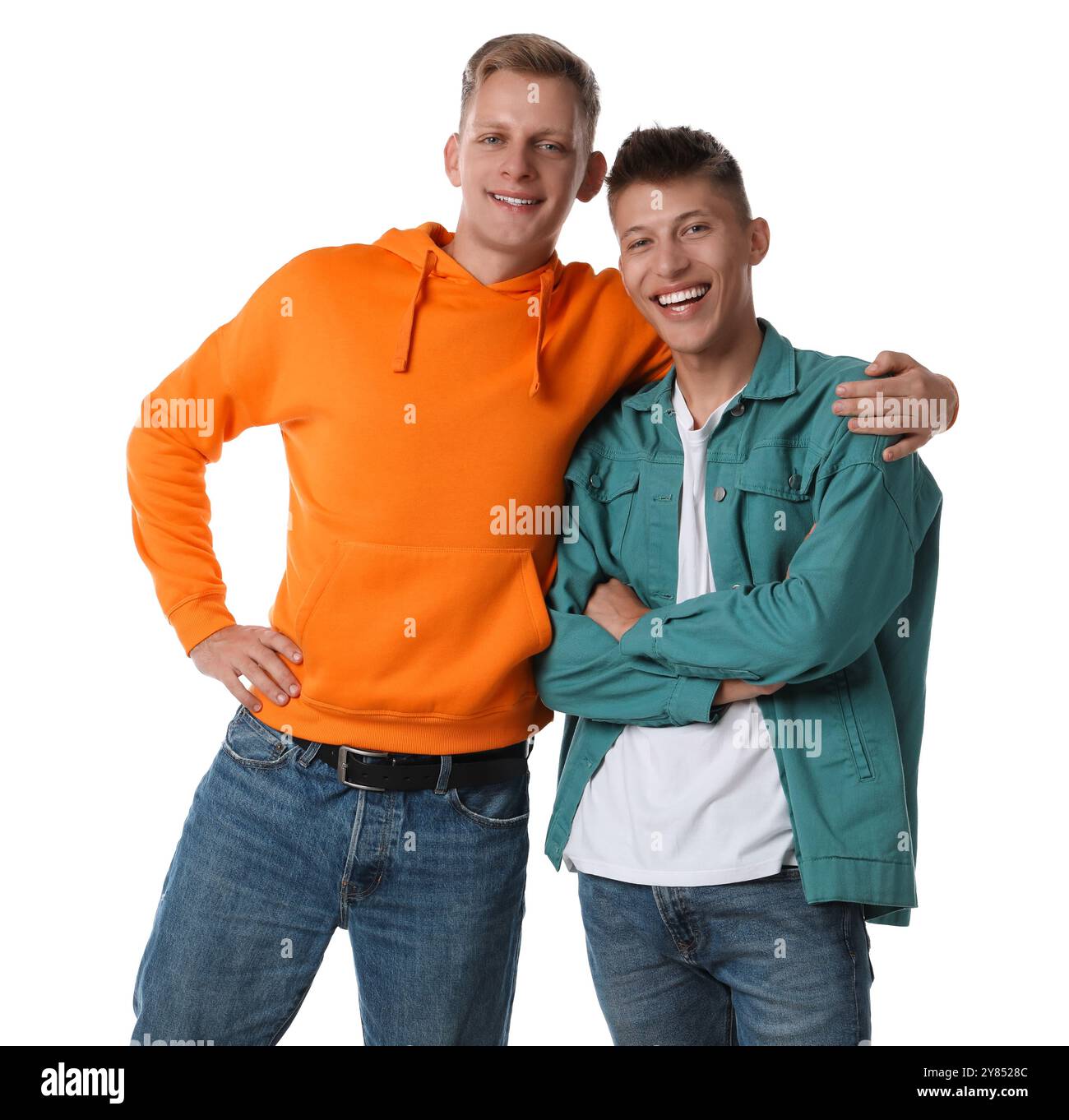 Two happy brothers posing on white background Stock Photo - Alamy