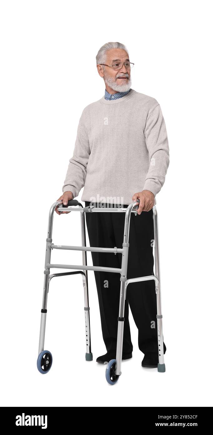 Senior man using walking frame on white background Stock Photo - Alamy