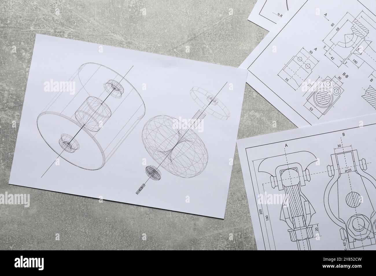 Different engineering drawings on gray textured table, top view Stock ...