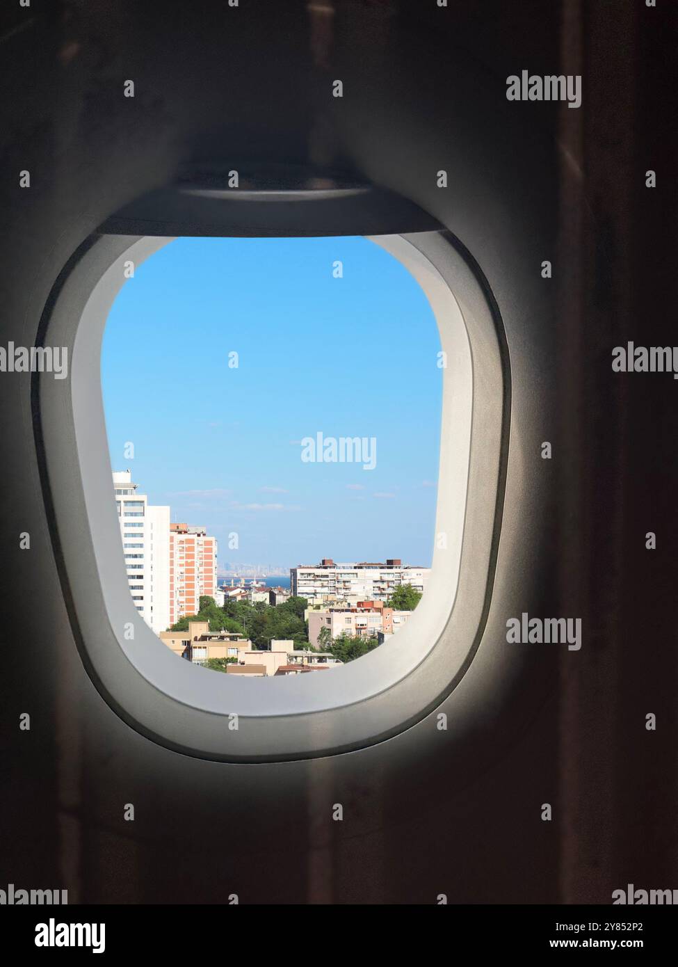 Airplane taking off or landing, view on city from window Stock Photo ...