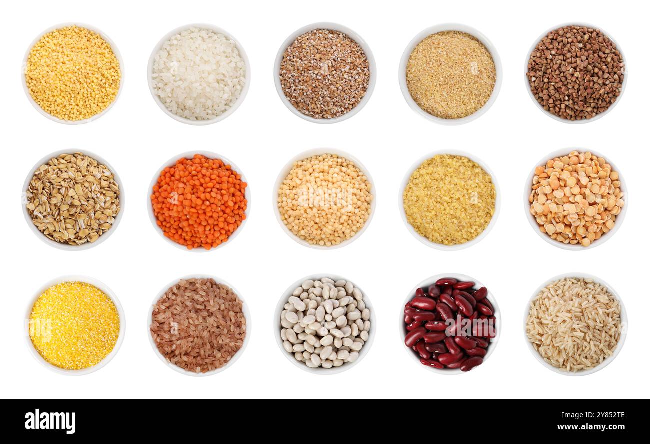 Different cereal grains and beans in bowls on white background, top ...