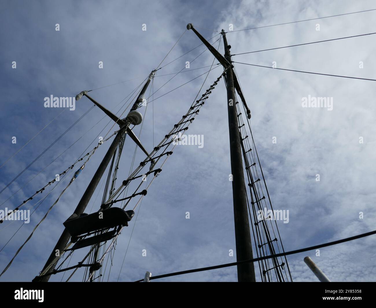Sailboat masts without sails with sky background Stock Photo - Alamy