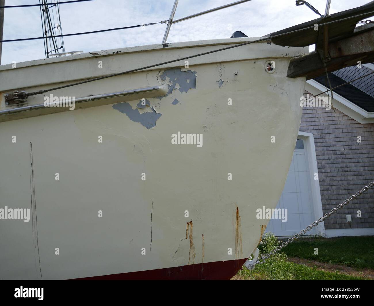Old sailing ship with peeling paint on hull retired and out of service ...