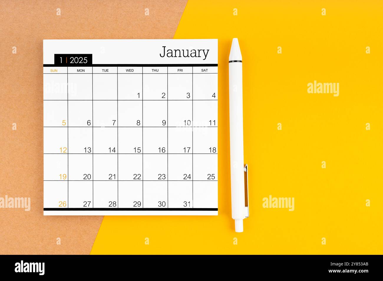 January 2025 Monthly calendar for 2025 year with pen on yellow ...