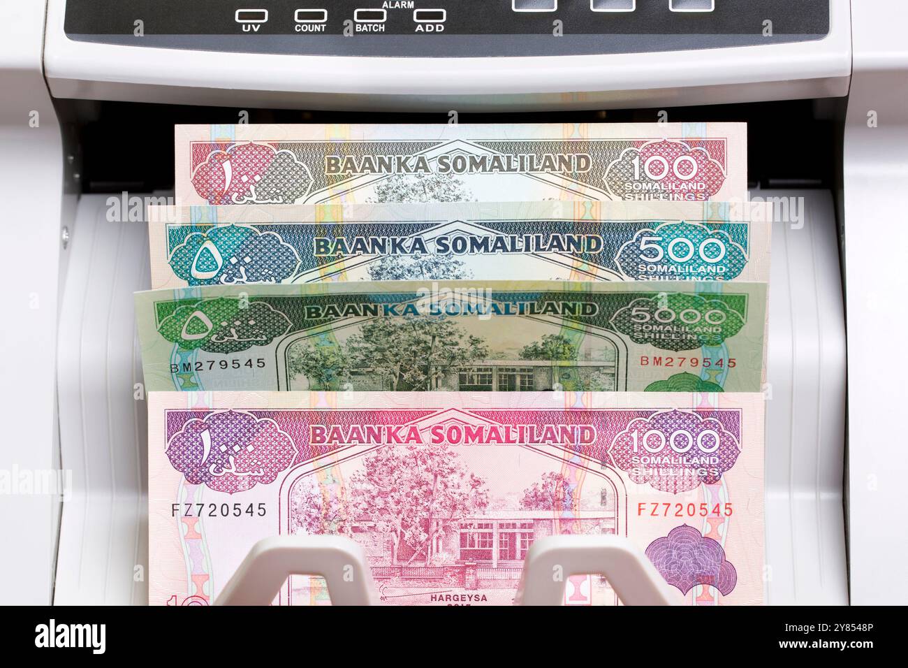 Somaliland money - shilling in the counting machine Stock Photo - Alamy