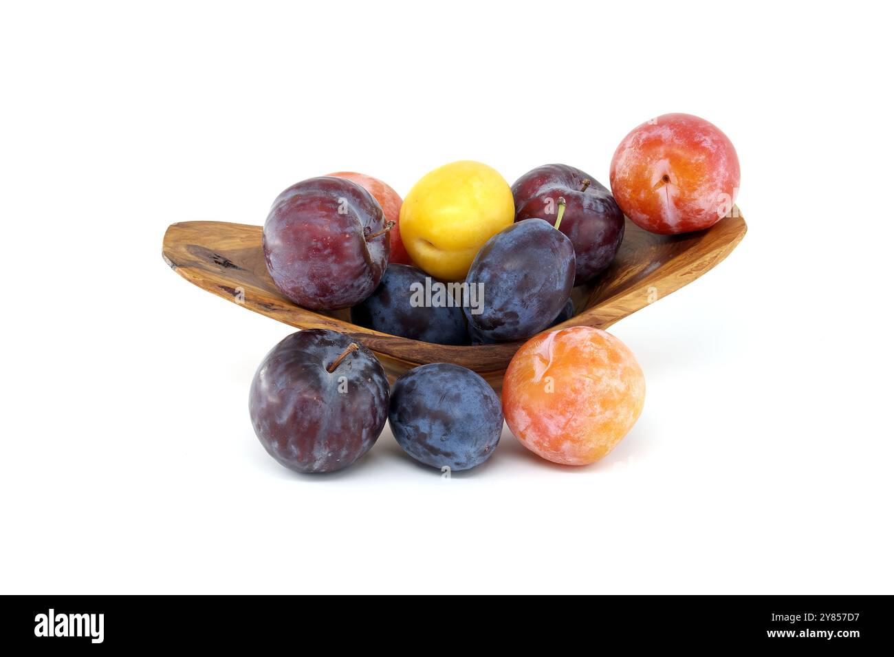 Variety of fresh plums in a wooden bowl showcasing vibrant colors ...