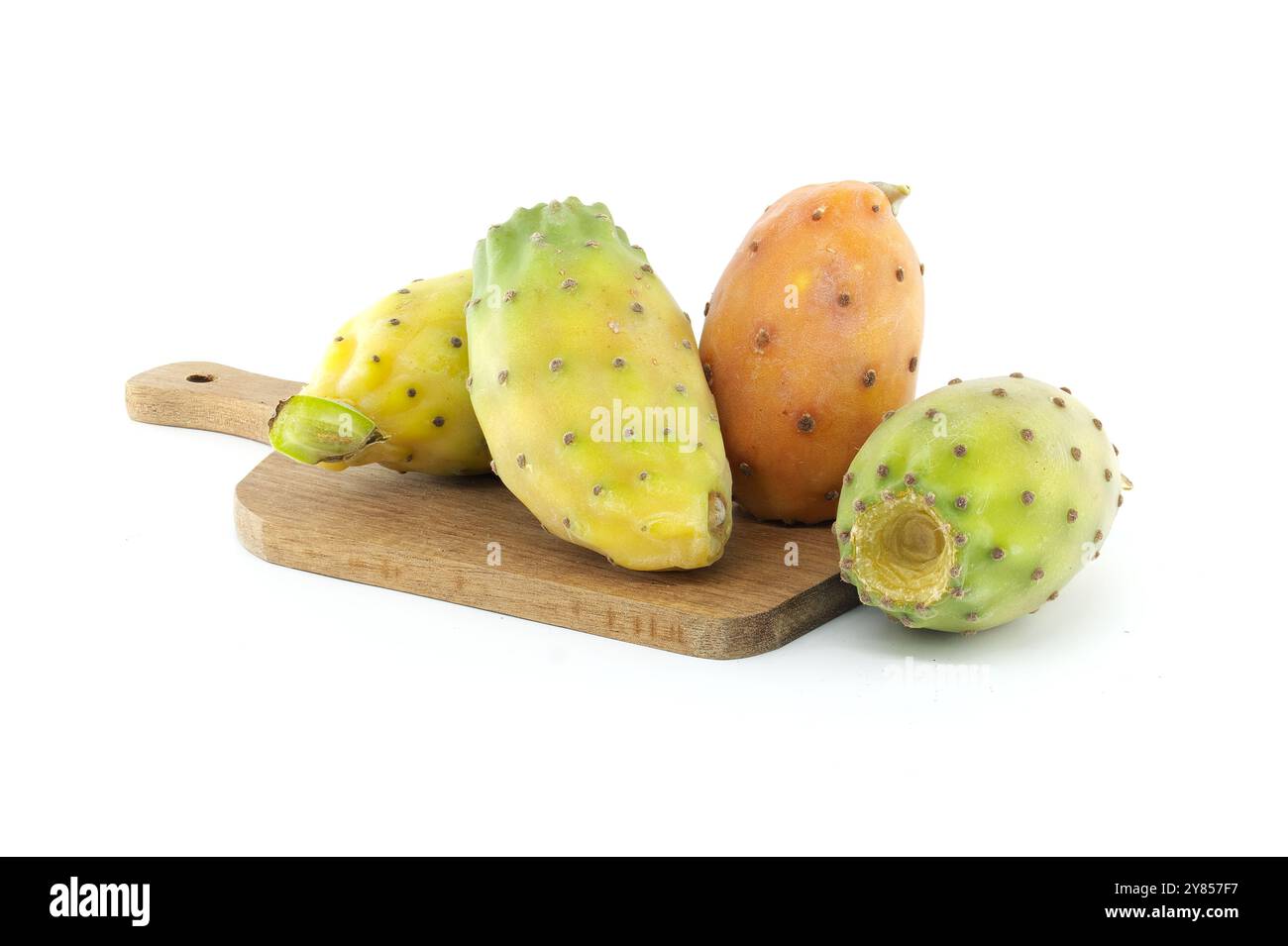 Colorful prickly pears displayed on a wooden cutting board. The image ...