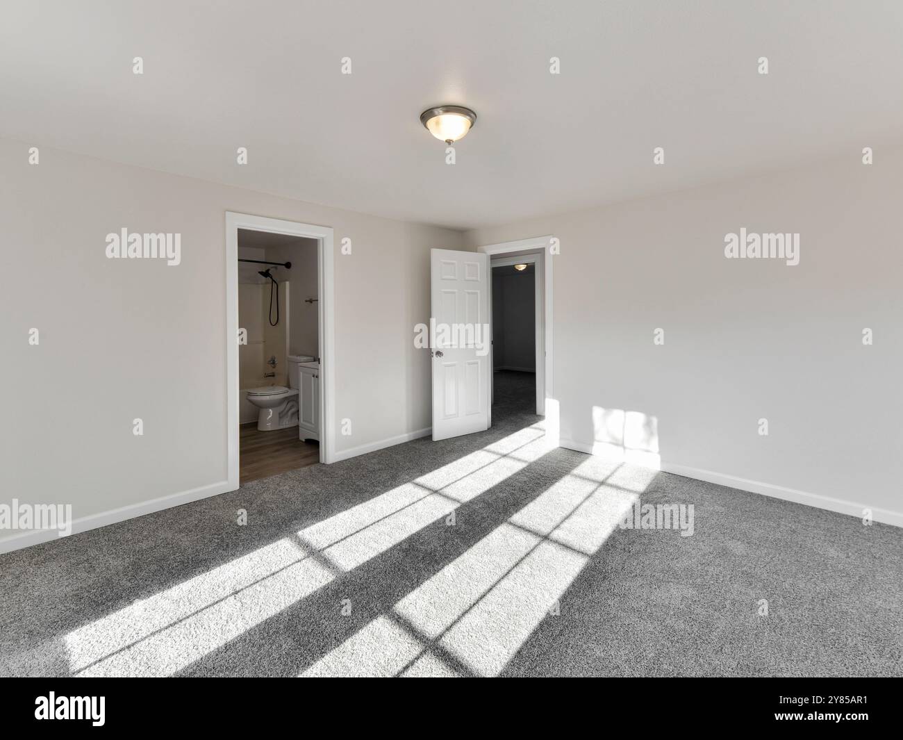 Modern residential empty bedroom interior Stock Photo - Alamy