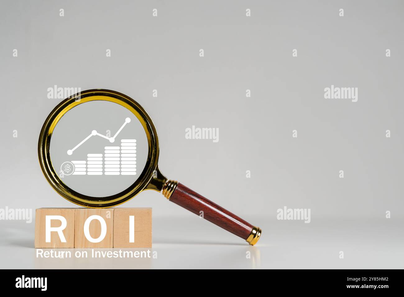 Analyzing Return on Investment (ROI) Concept. Businessman holding a ...