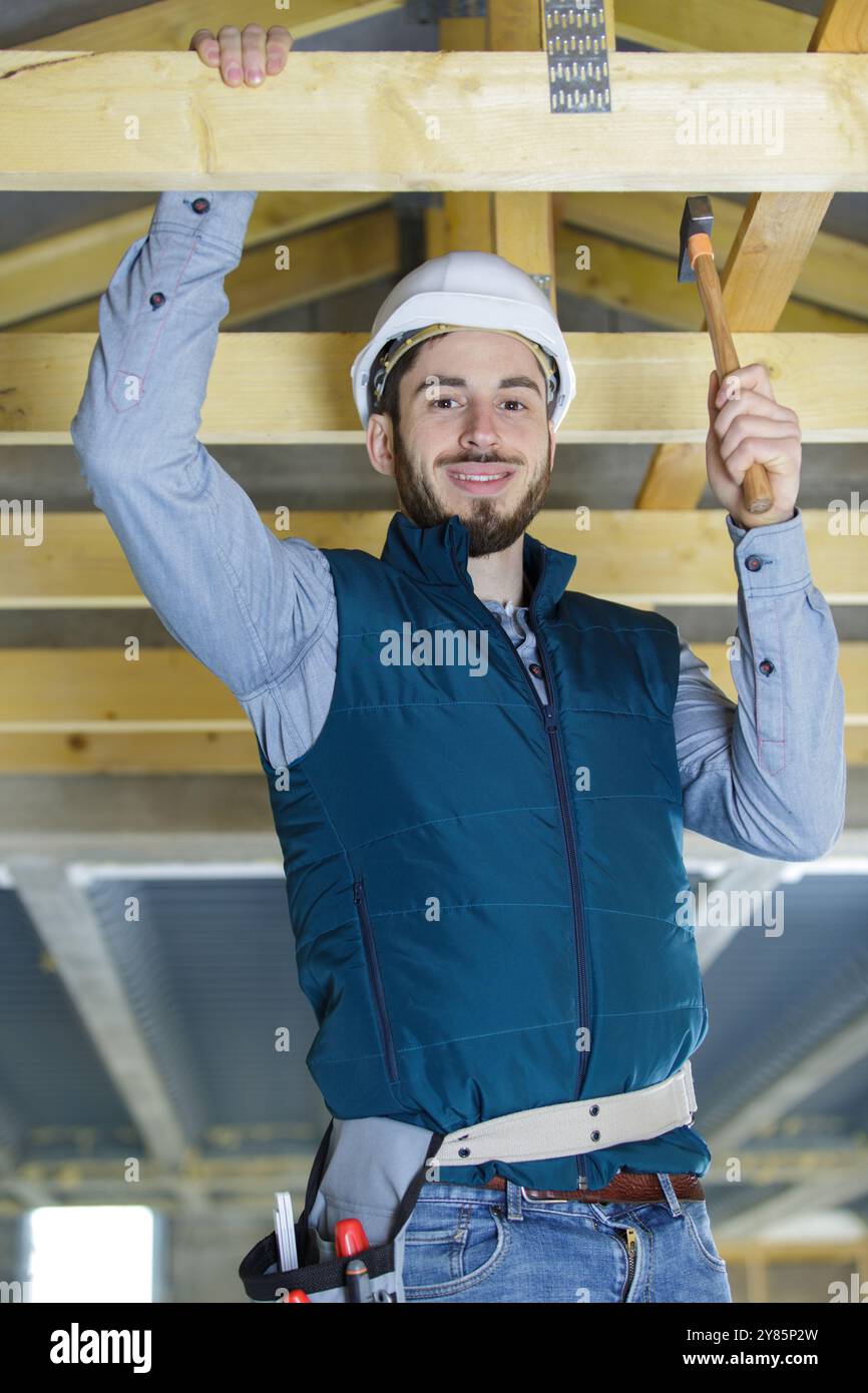 contractor repair uses a hammer in wood structure Stock Photo - Alamy