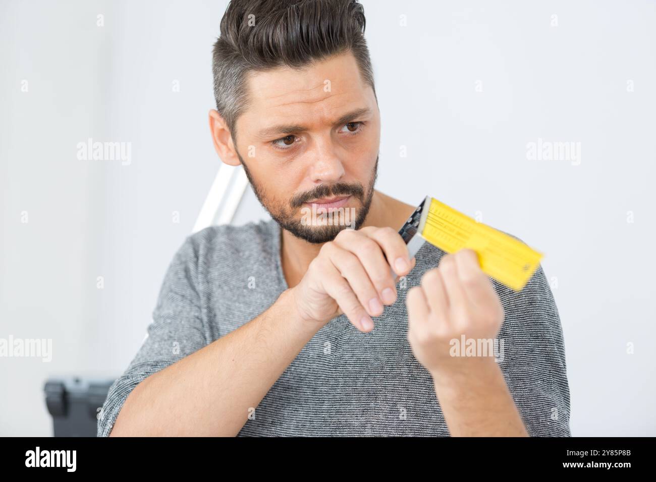 mechanic fixing something Stock Photo - Alamy