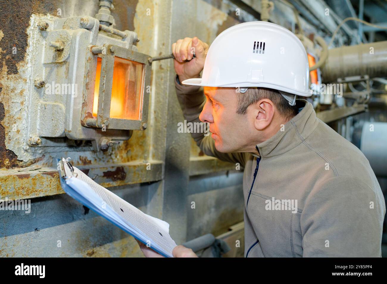 a man checking welding factory Stock Photo - Alamy