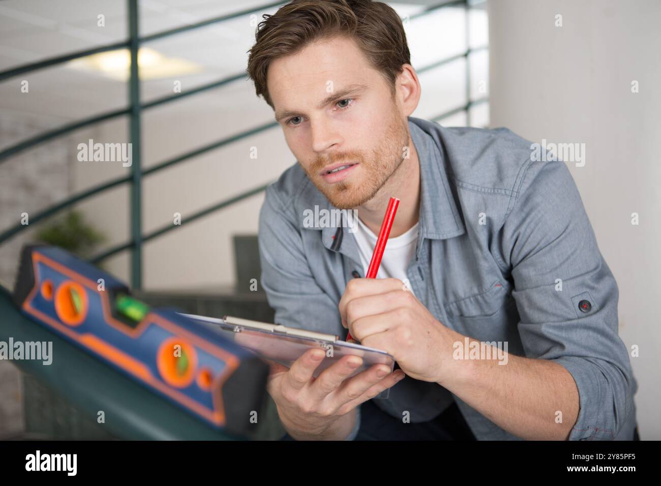 professional checking level with clipboard Stock Photo - Alamy