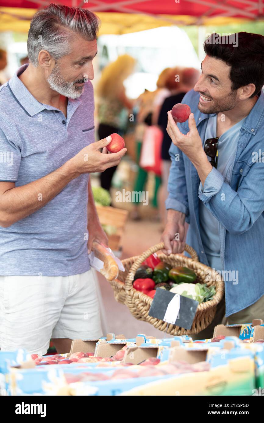 two men making a choice between two similar goods Stock Photo - Alamy