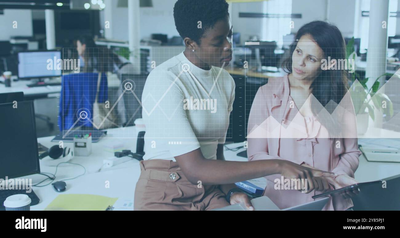 Business data analytics image over two women collaborating in modern ...