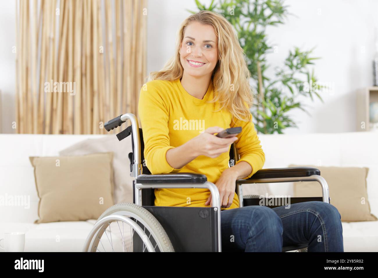 disabled woman in wheelchair watching tv Stock Photo - Alamy