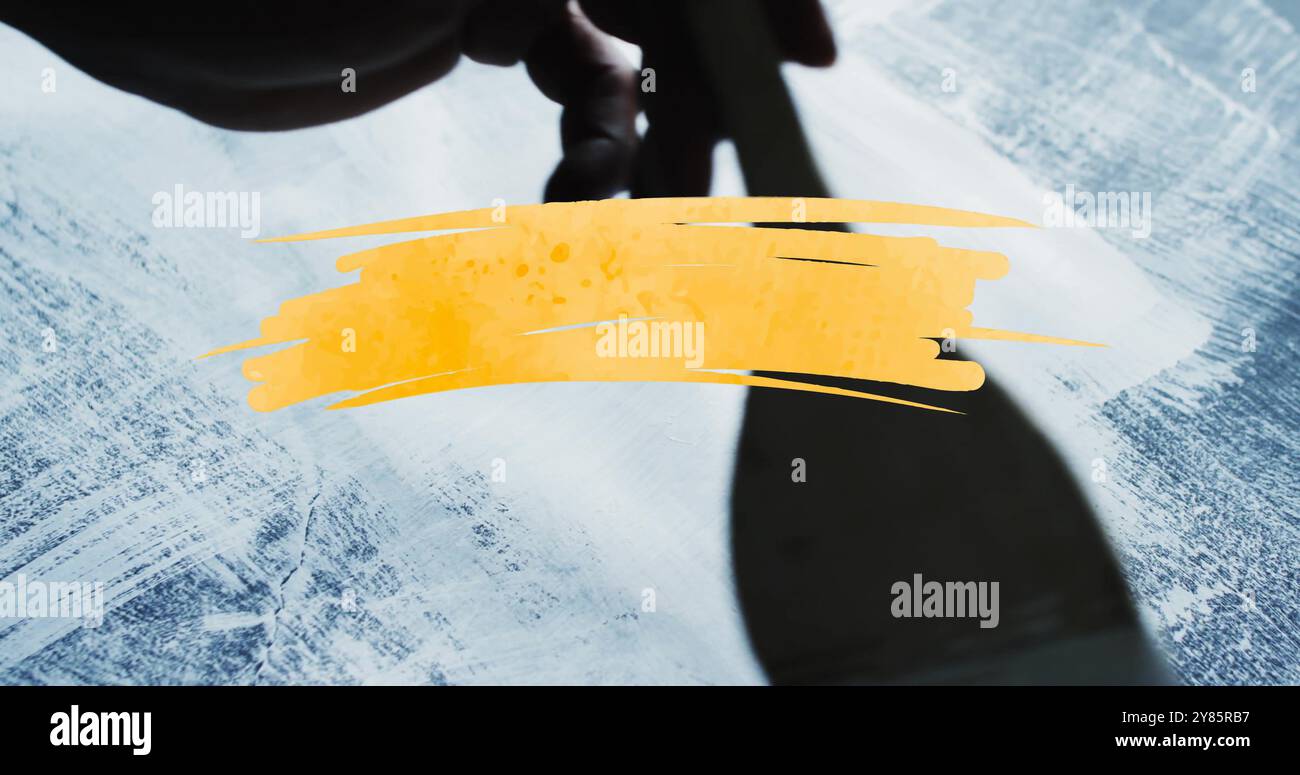 Image of yellow paint smudge with copy space over hand with paint ...