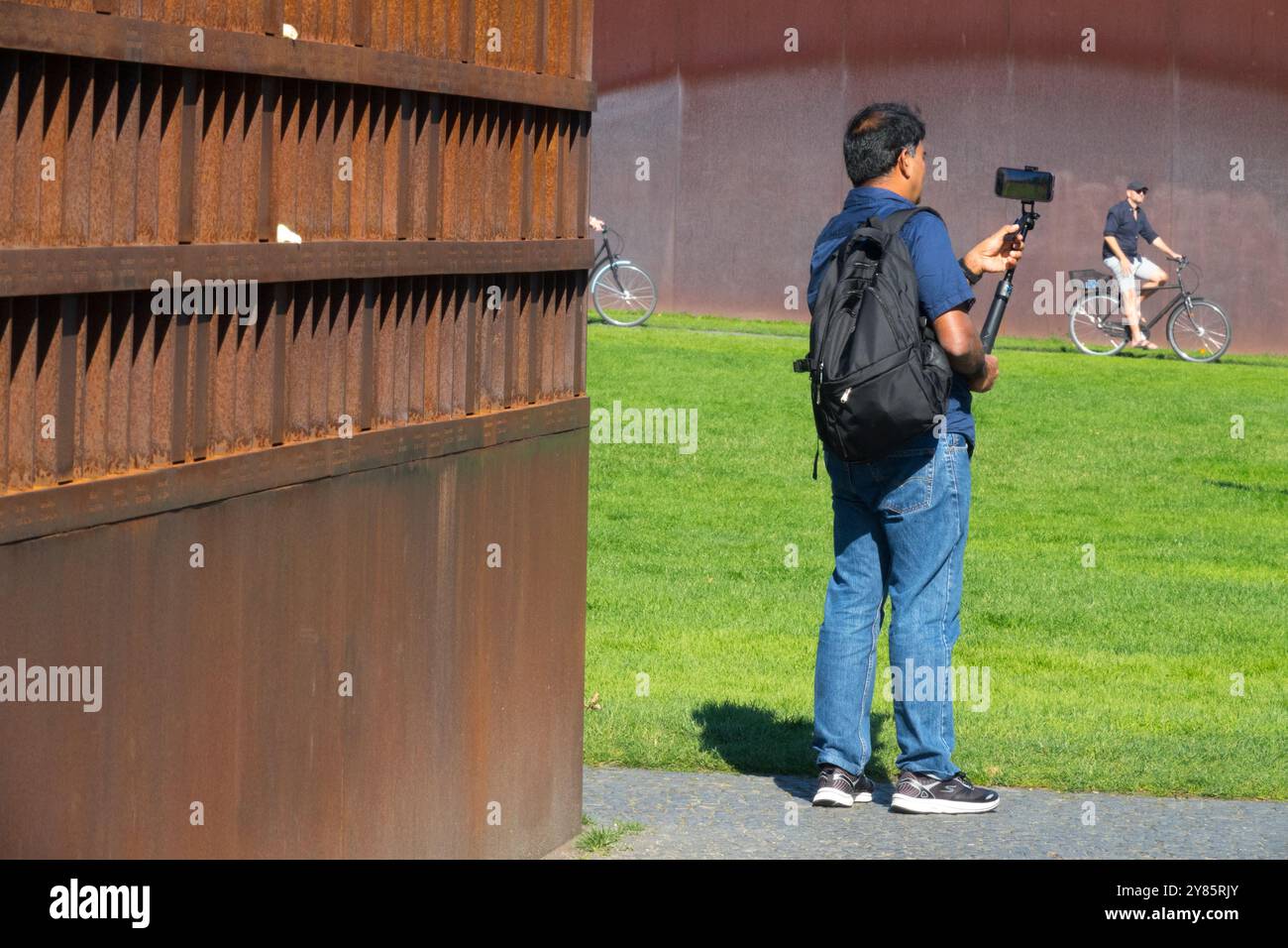 Tourist Visitor Man with Mobile Phone Stick Berlin Wall Memorial ...