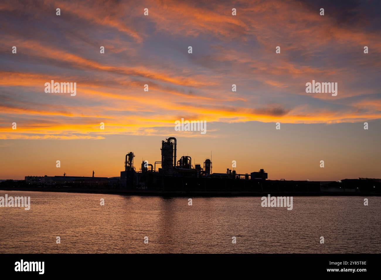 A stunning sunset over Bukseong Port in Incheon, where the silhouettes ...