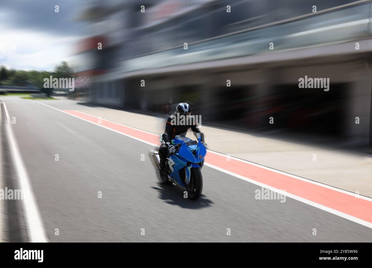 Motorcyclist on a racing motorcycle back from the race track to the ...