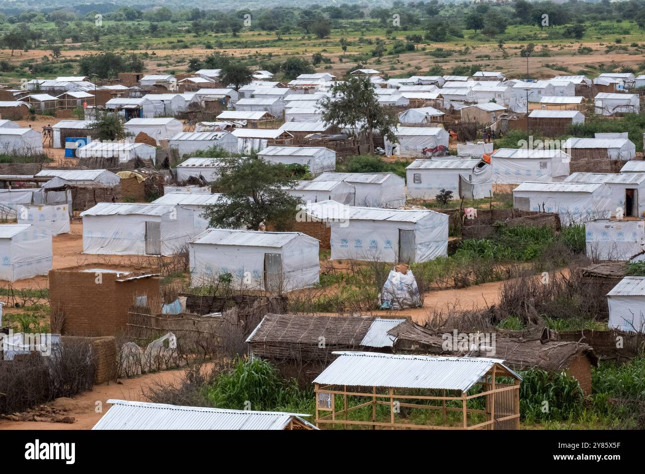 General view of the landscape of the housing with the logo of the ...
