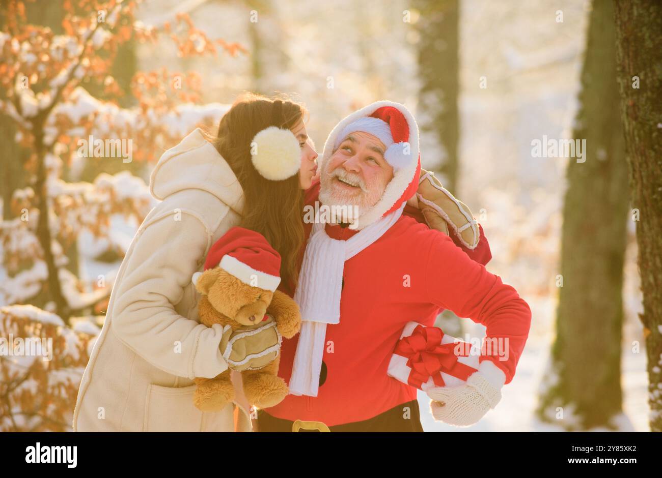 Elderly man kissing girl hi-res stock photography and images - Alamy