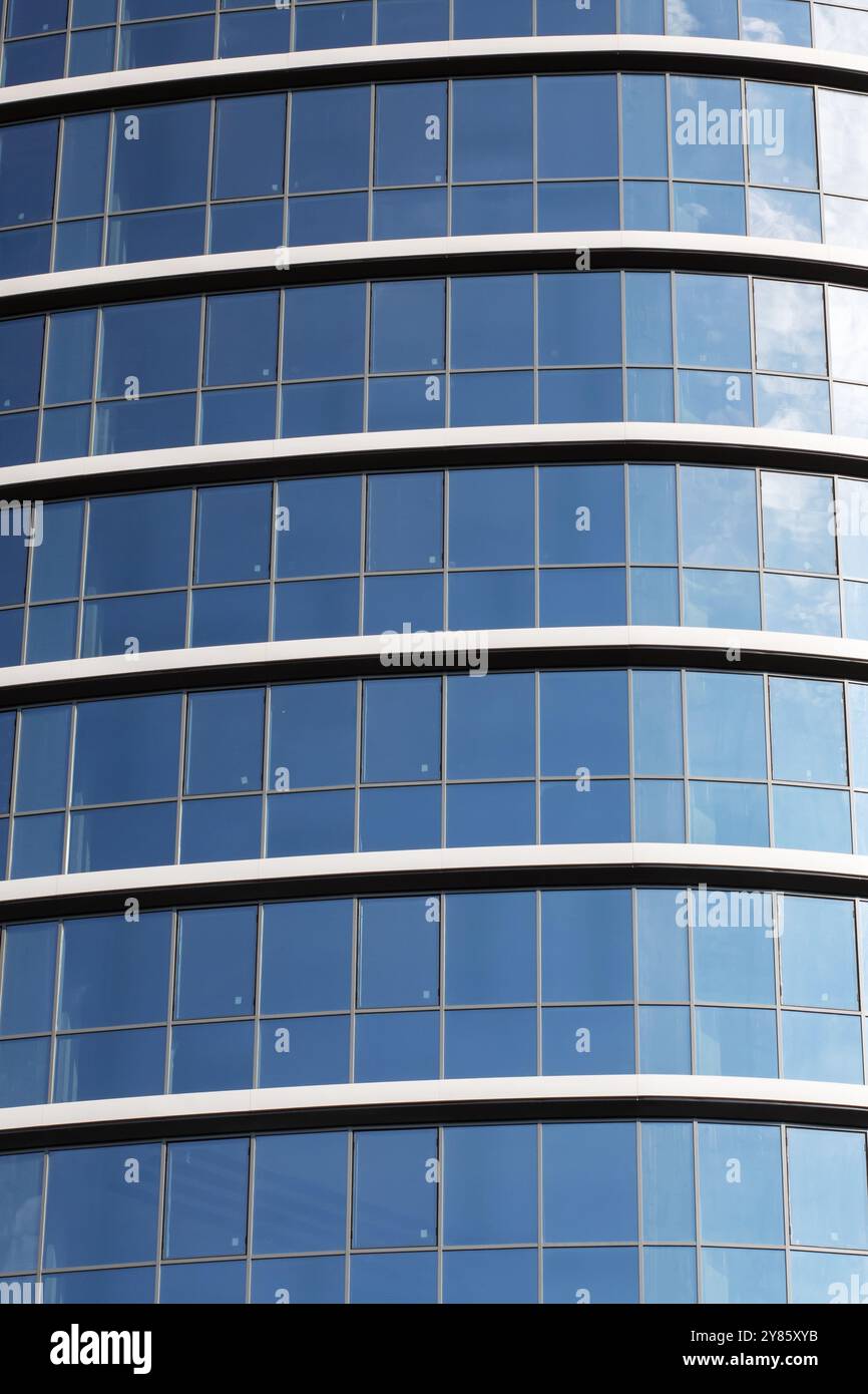 A modern building that showcases a vibrant blue sky beautifully ...