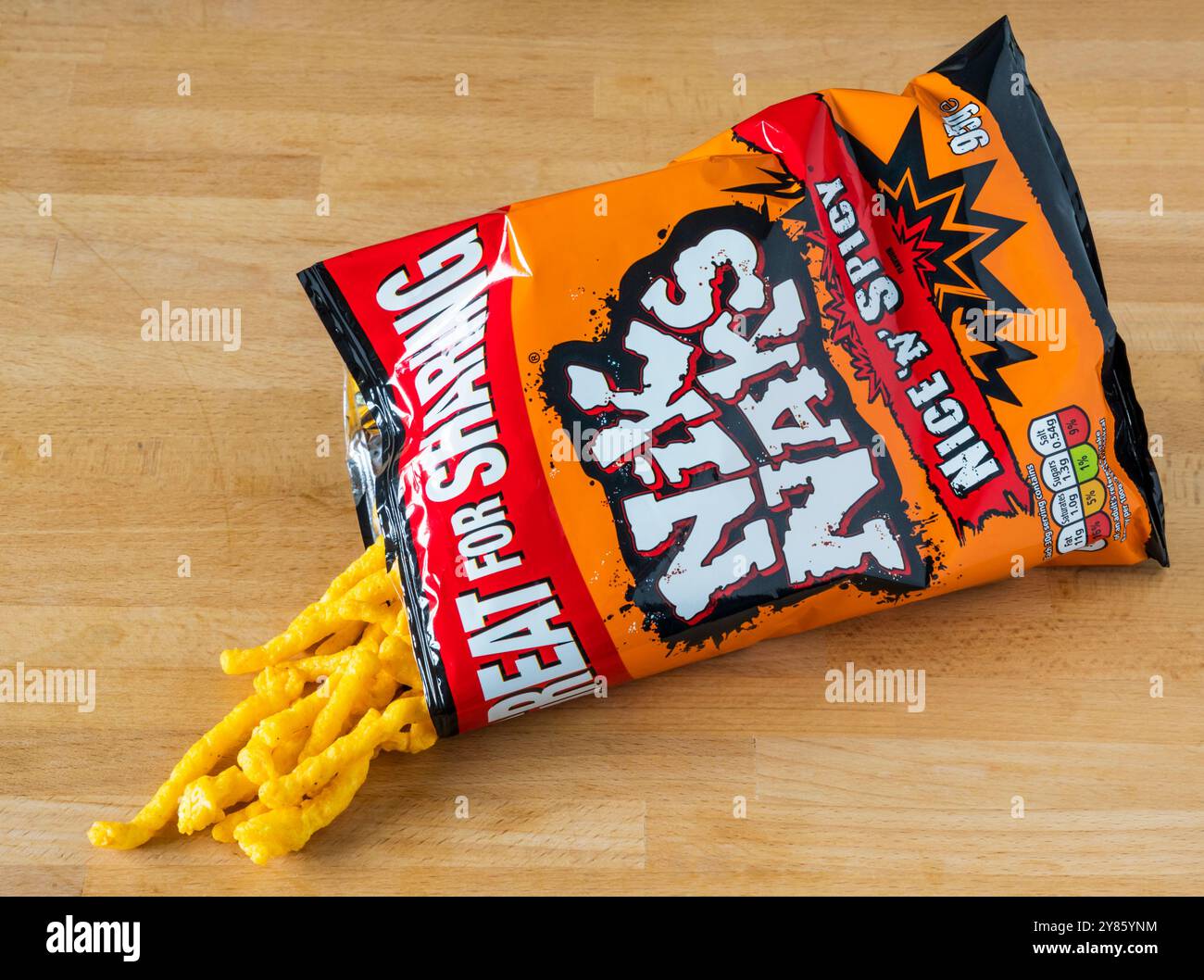 An opened packet of Nice 'n' Spicy Nik Naks extruded corn snacks Stock ...