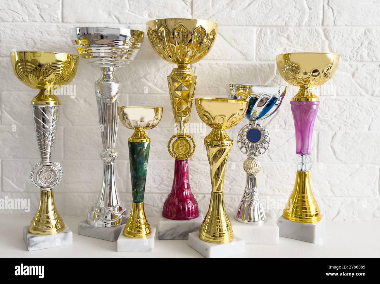 group of trophy displayed on the shelf Stock Photo - Alamy