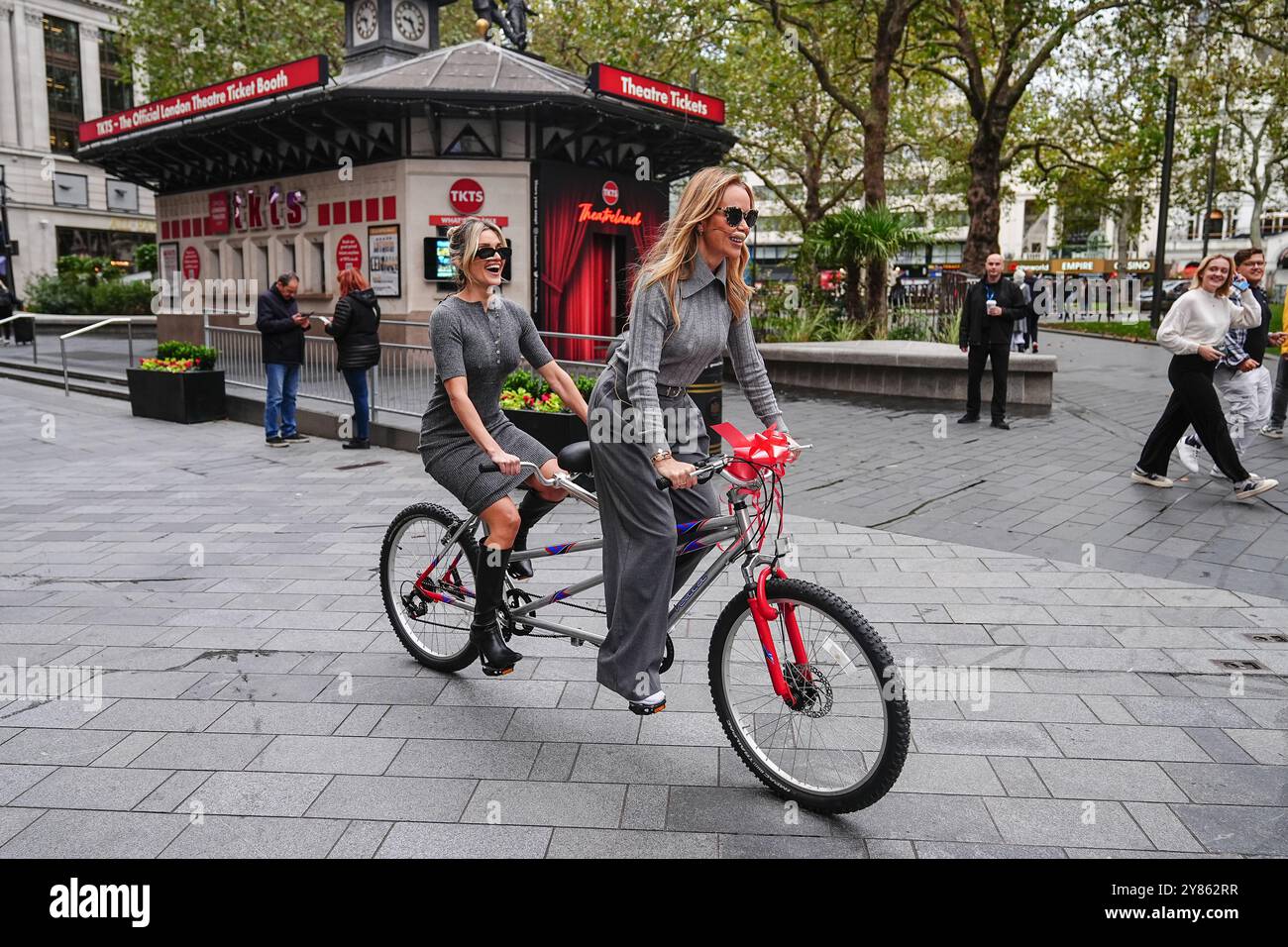 Amanda Holden and Ashley Roberts ride a tandem bike to launch Amanda ...