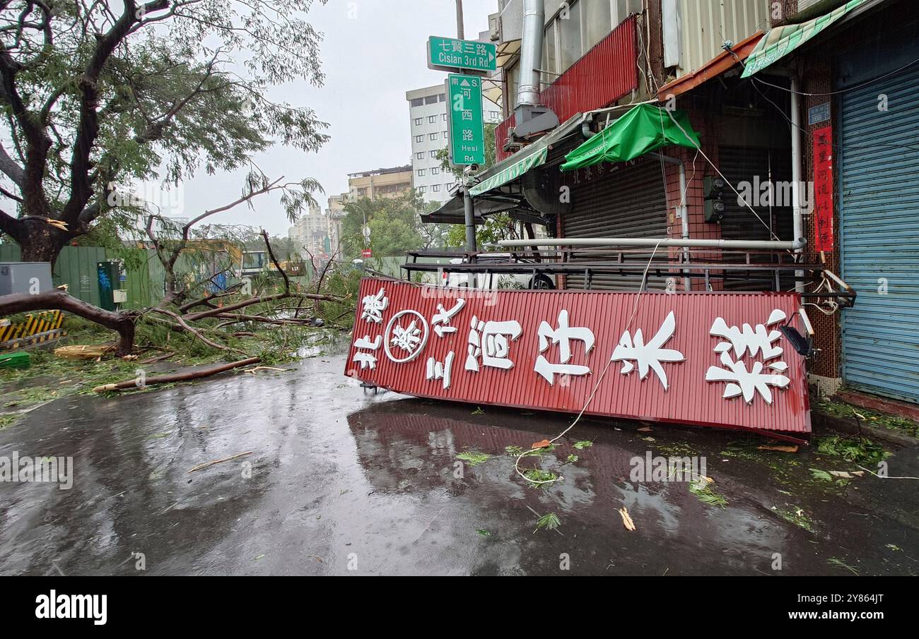 A fallen signage lies on the pavement as as Typhoon Krathon makes ...