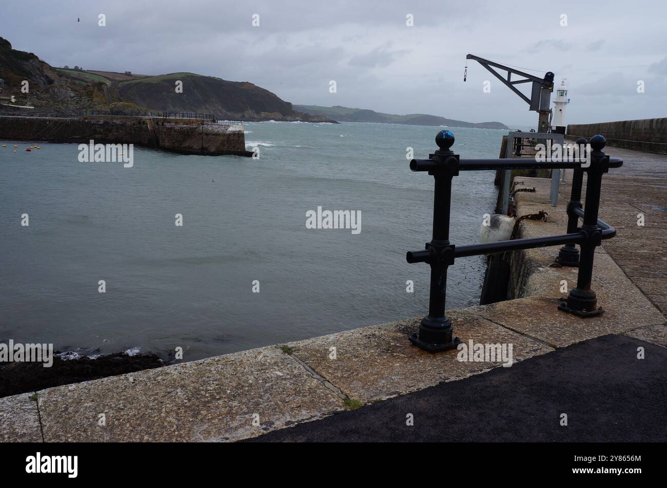 Outer Harbour wall and cliffs Mevagissey Cornwall England UK Stock ...