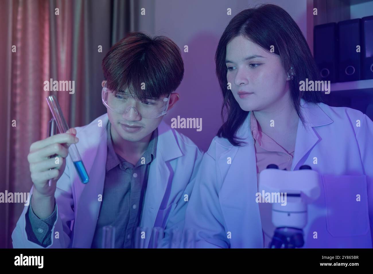 Scientists Conducting Experiments in a Modern Laboratory Setting with ...