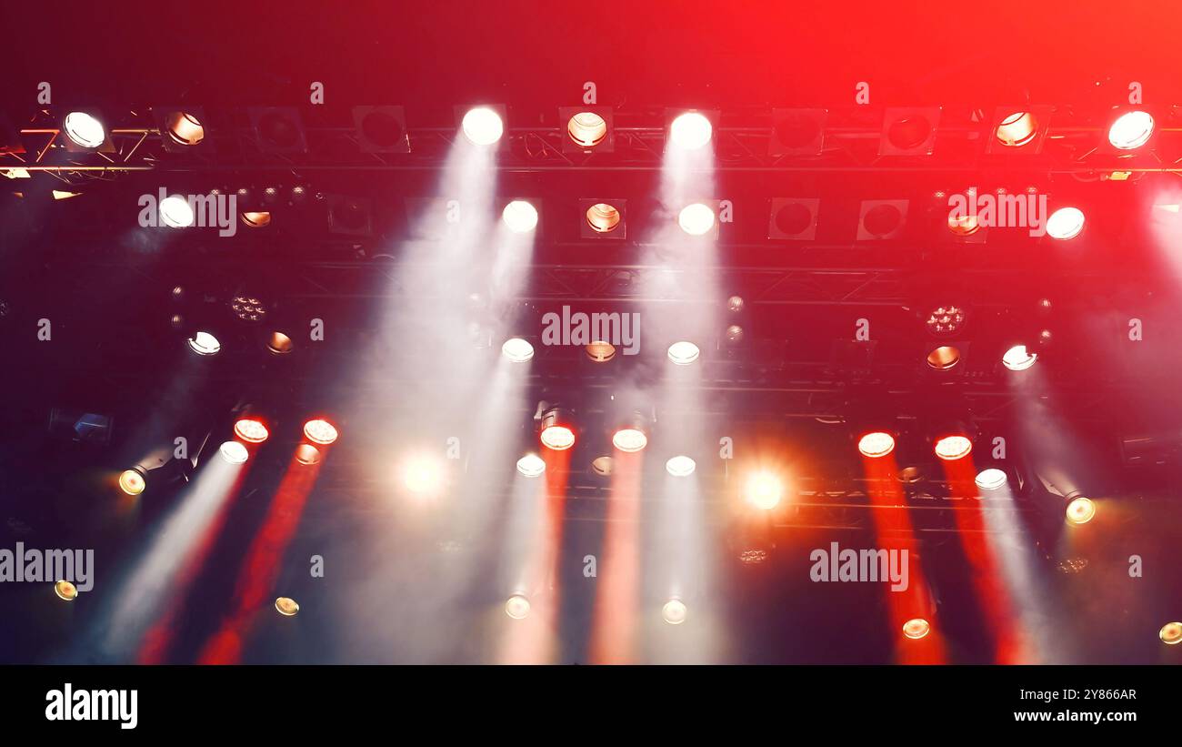 glowing ceiling spotlights lights the stage during the concert Stock ...