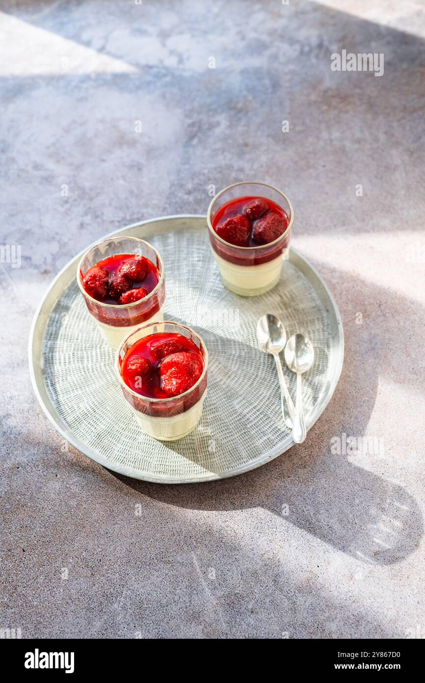 Lemon Posset dessert with Poached Strawberries Stock Photo - Alamy
