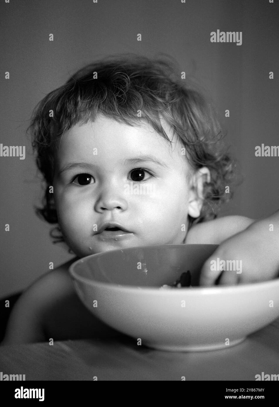 Funny kid eating Black and White Stock Photos & Images - Alamy
